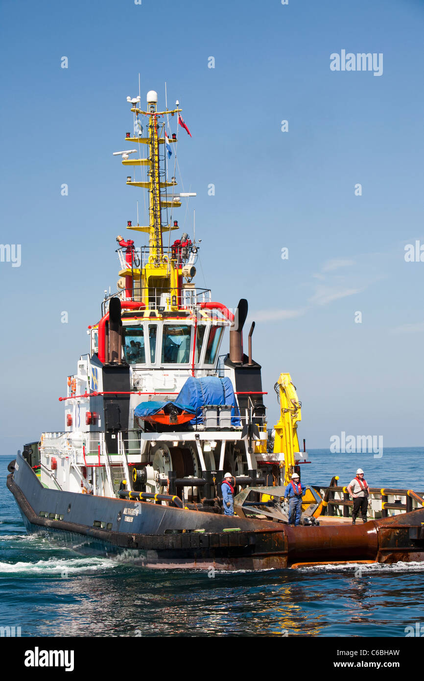 A tug boat towing a jack up barge, the Goliath, out to work on the ...