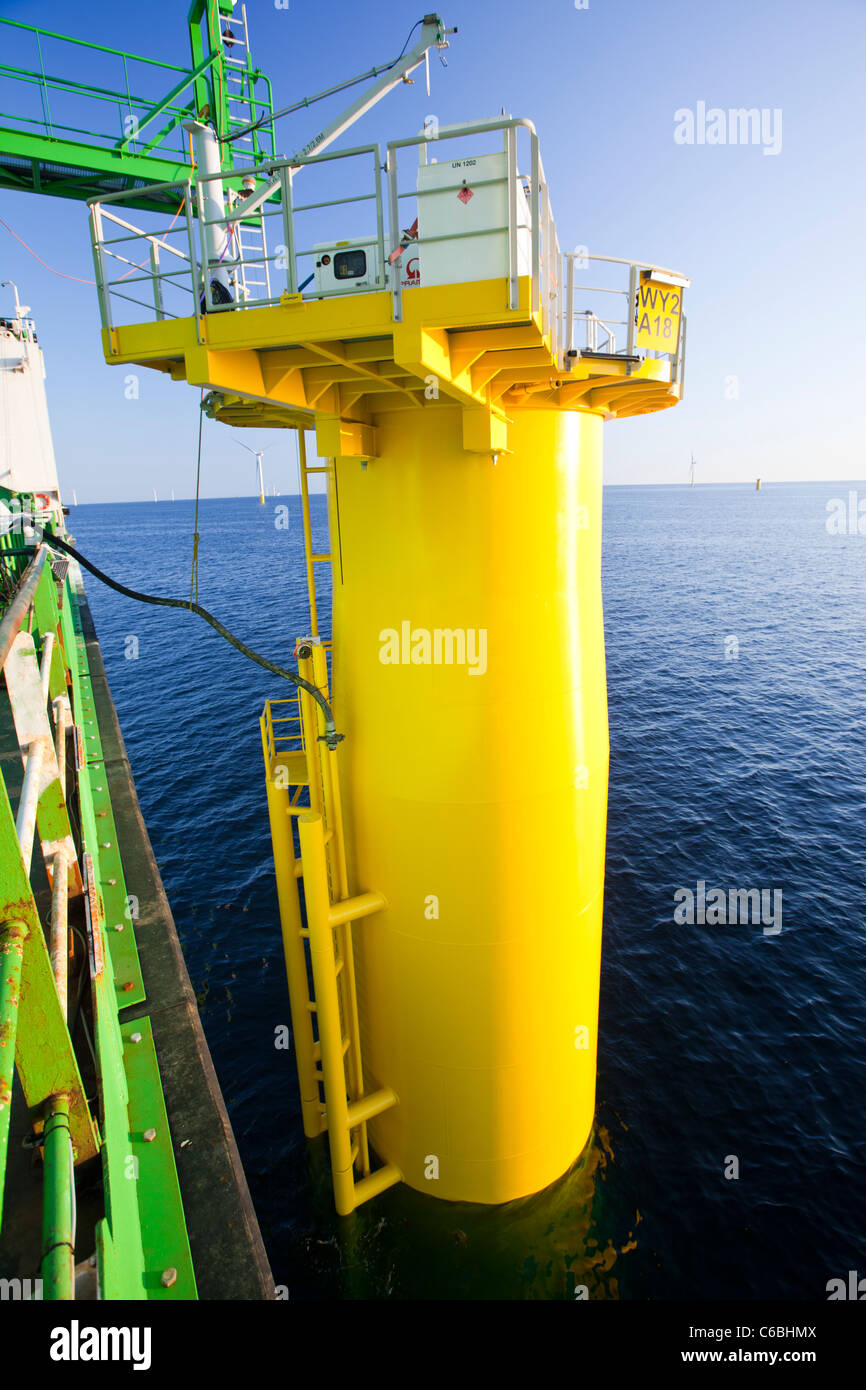 A pipe carries specialist grout to cement a transition piece to a ...