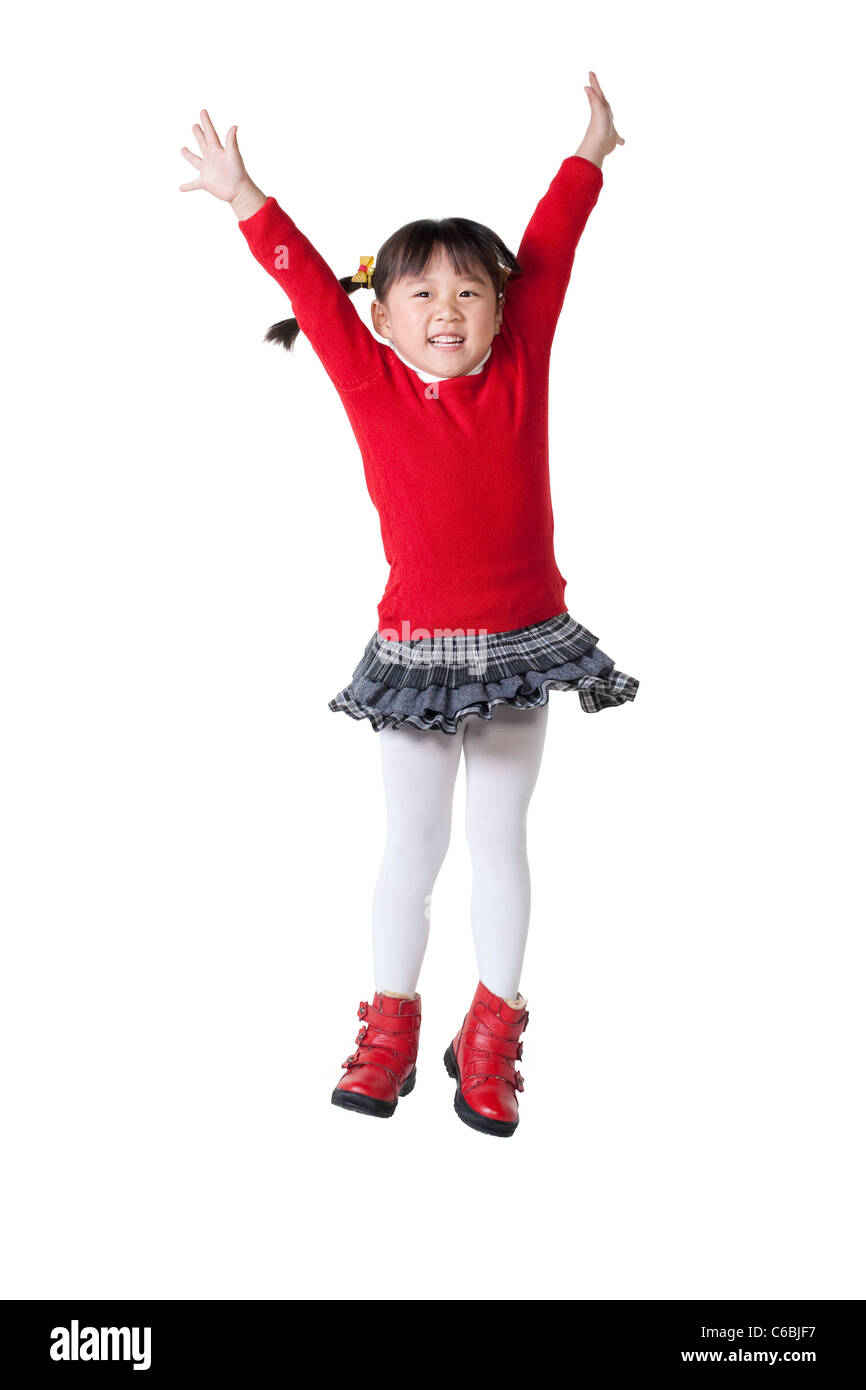 Cute Chinese girl jumping Stock Photo - Alamy
