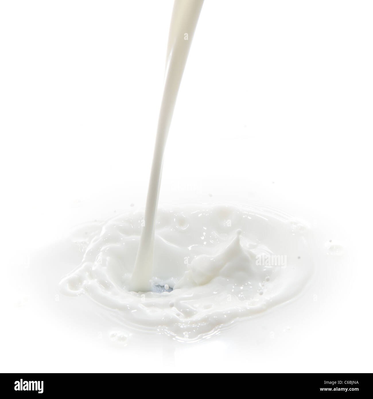 pouring milk splash isolated on white background Stock Photo - Alamy