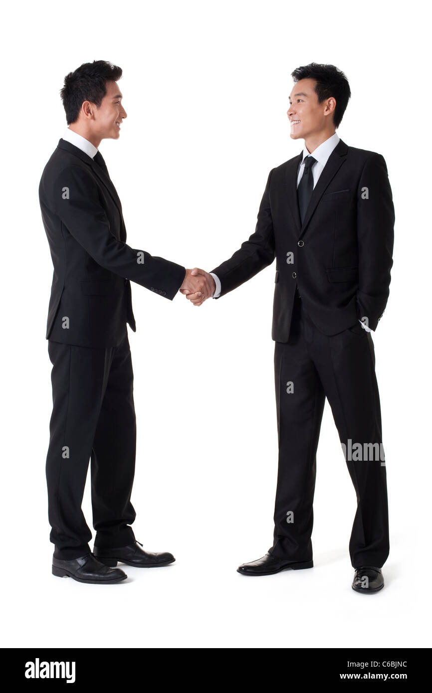 Businessmen shaking hands Stock Photo - Alamy