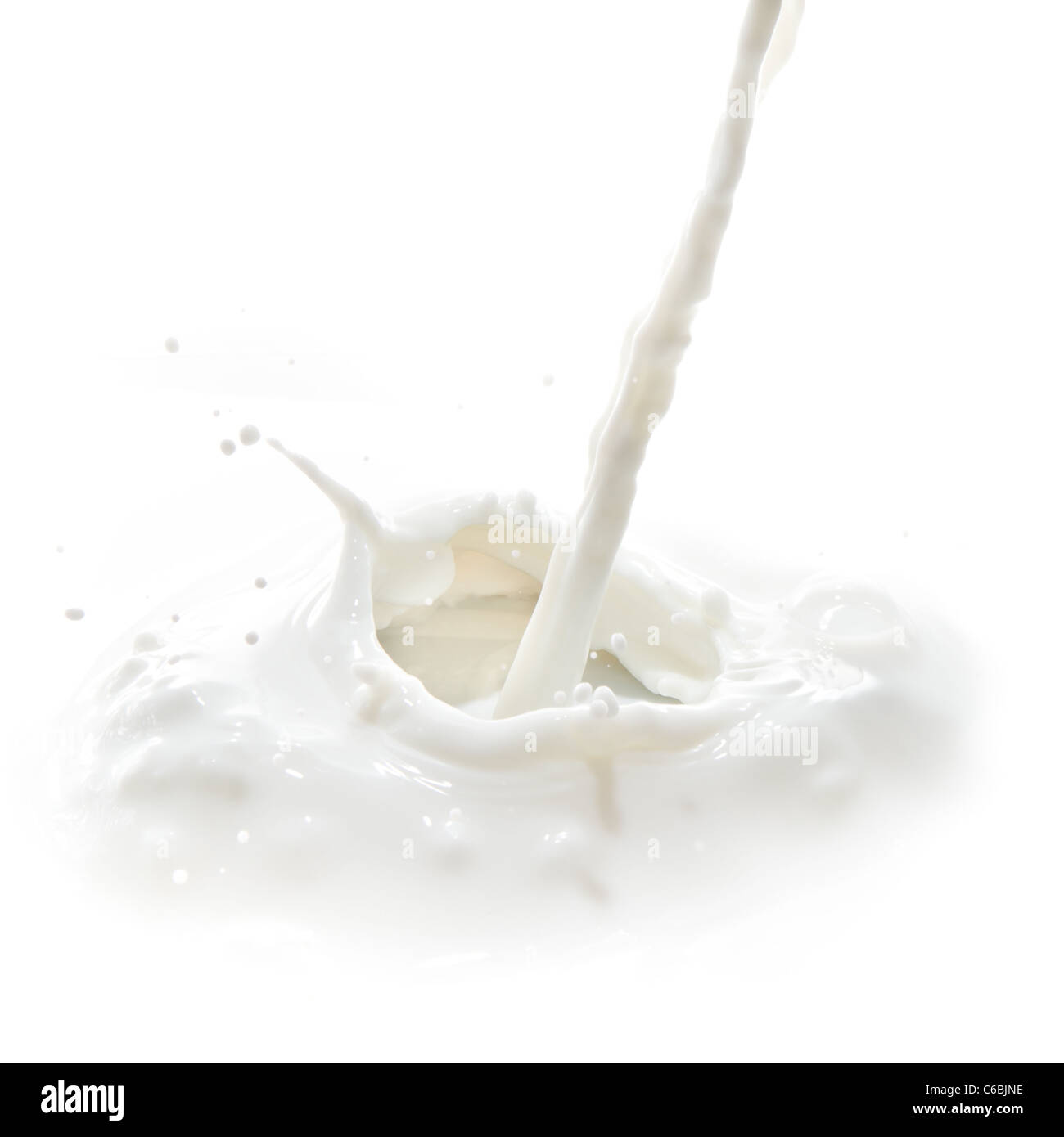 pouring milk splash isolated on white background Stock Photo - Alamy
