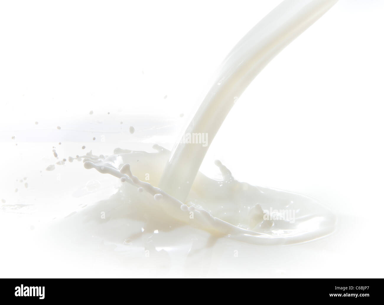 pouring milk splash isolated on white background Stock Photo - Alamy