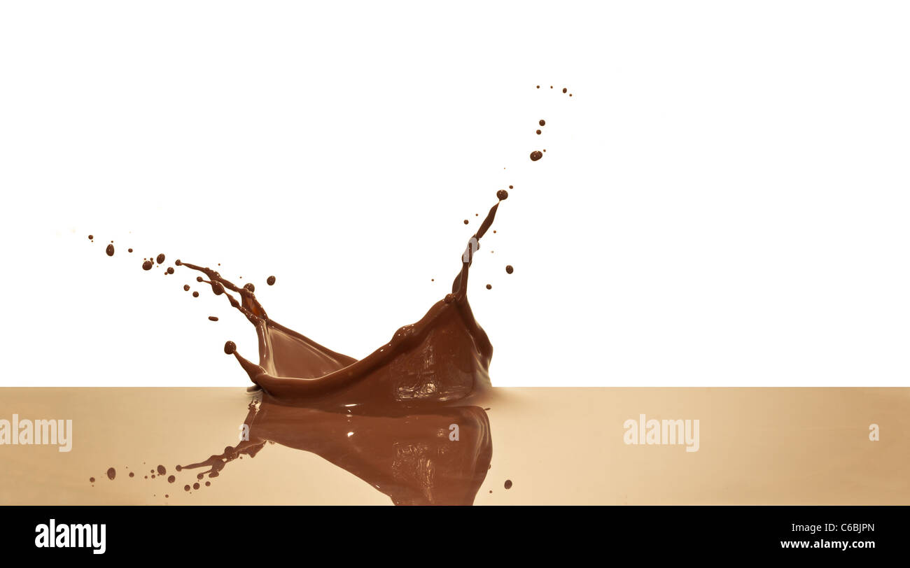 chocolate splash closeup isolated on white background Stock Photo - Alamy