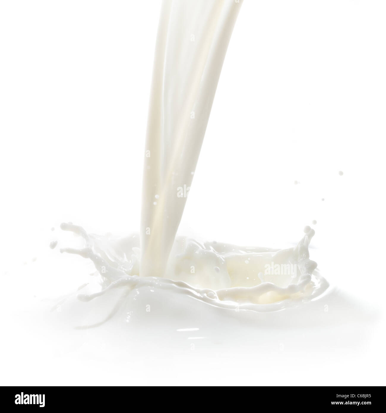 pouring milk splash isolated on white background Stock Photo - Alamy