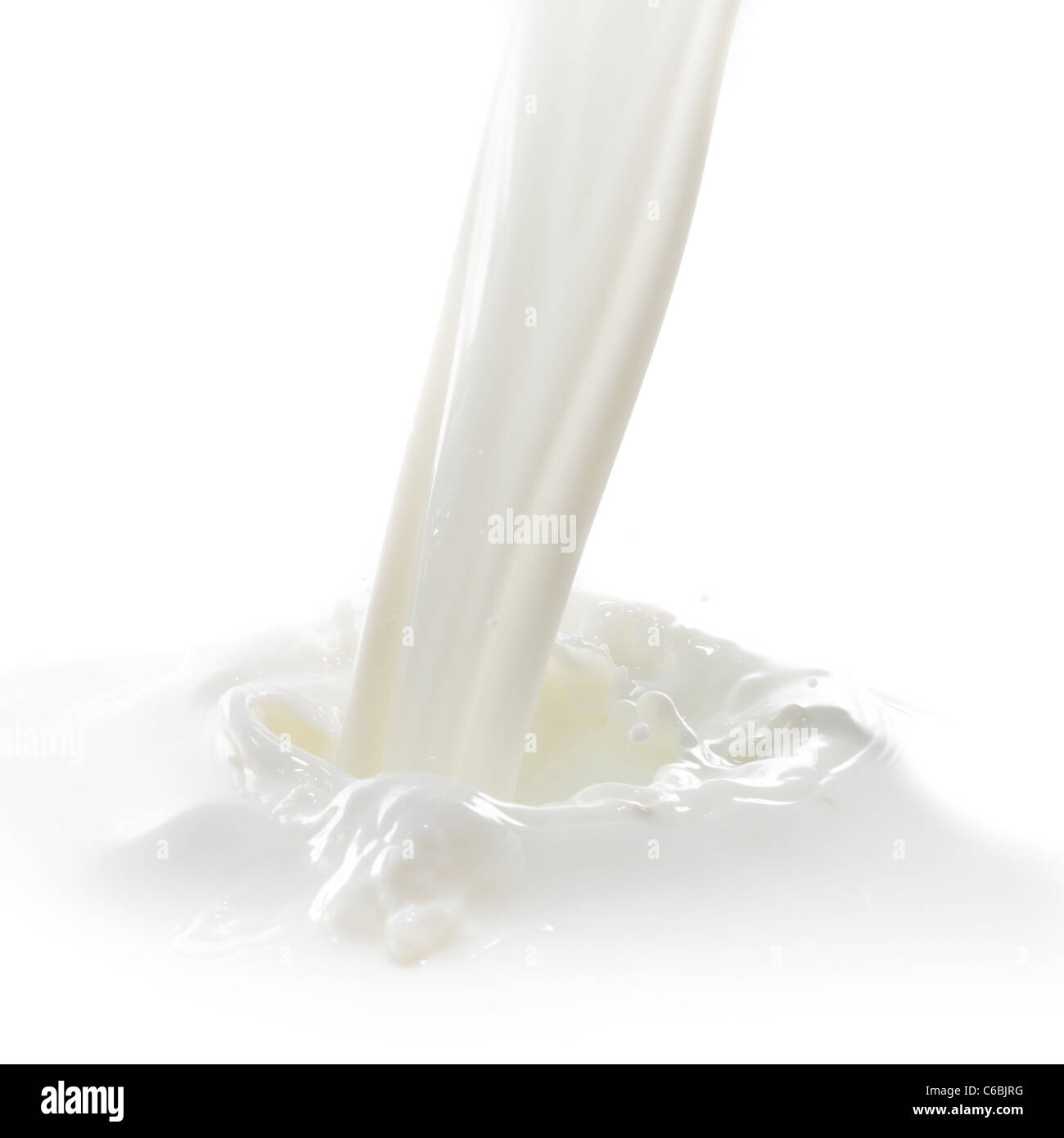 pouring milk splash isolated on white background Stock Photo - Alamy
