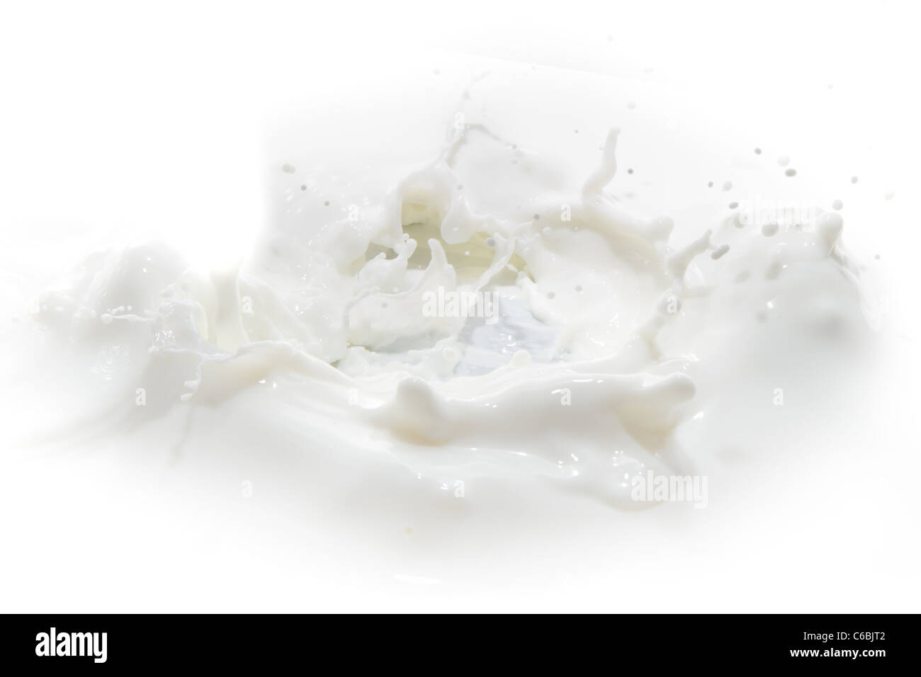pouring milk splash isolated on white background Stock Photo - Alamy