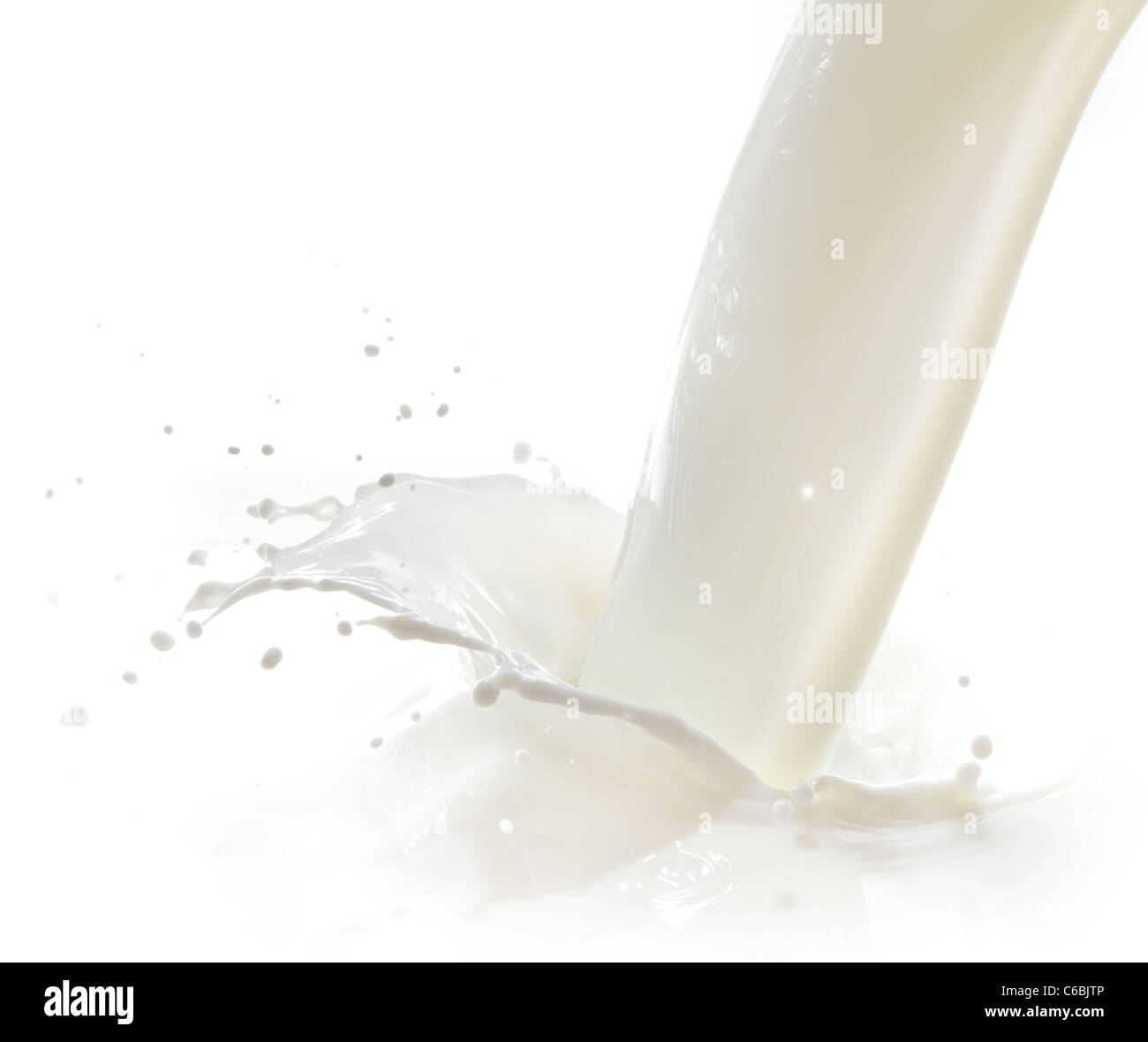 pouring milk splash isolated on white background Stock Photo - Alamy