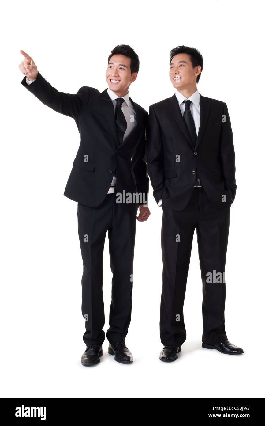 Businessman pointing the front Stock Photo - Alamy