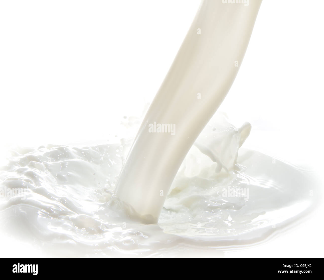 pouring milk splash isolated on white background Stock Photo - Alamy