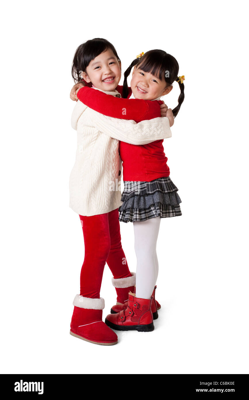 Two Chinese girls hugging Stock Photo - Alamy