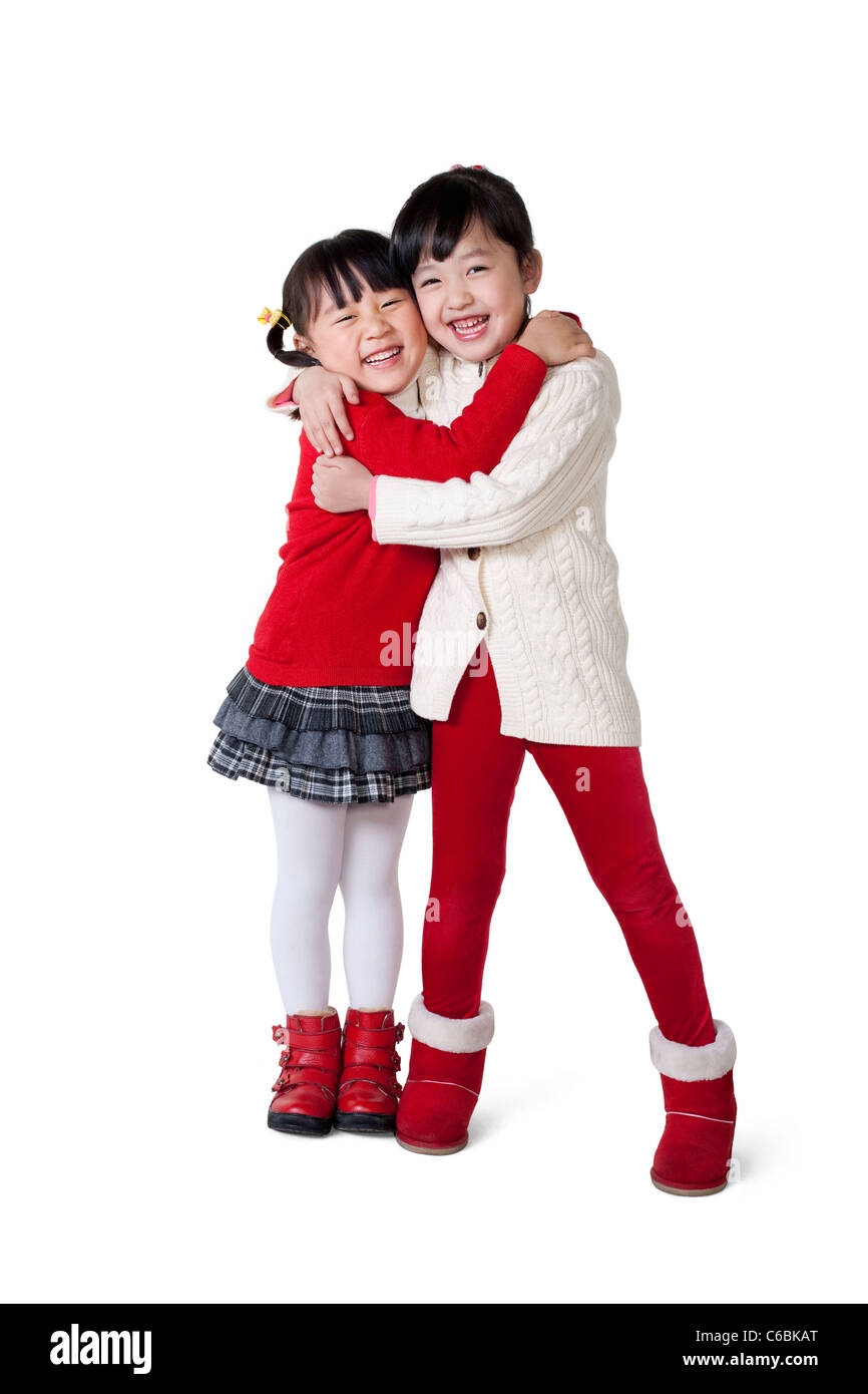 Two Chinese girls hugging Stock Photo - Alamy