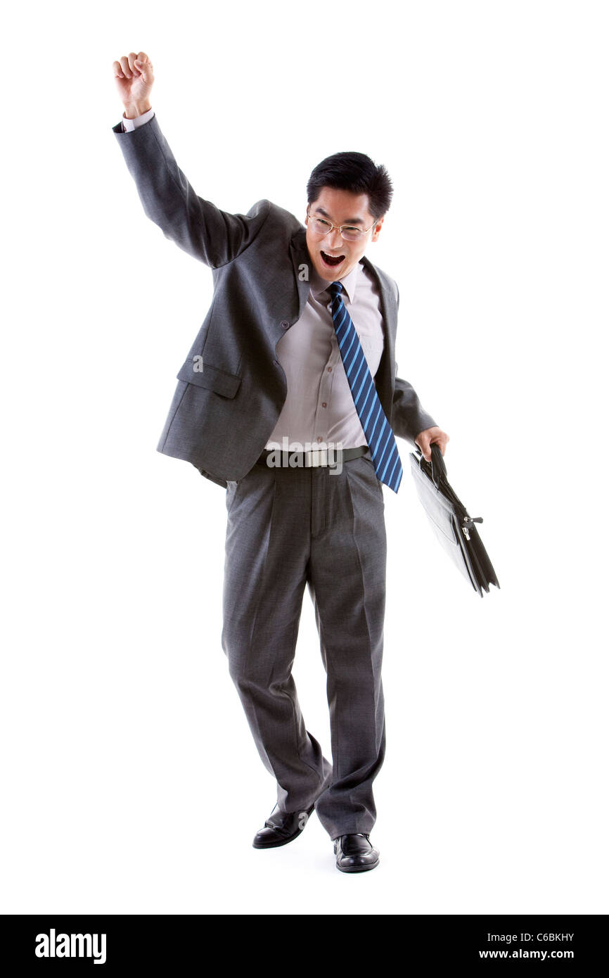 Businessman punching the air Stock Photo - Alamy