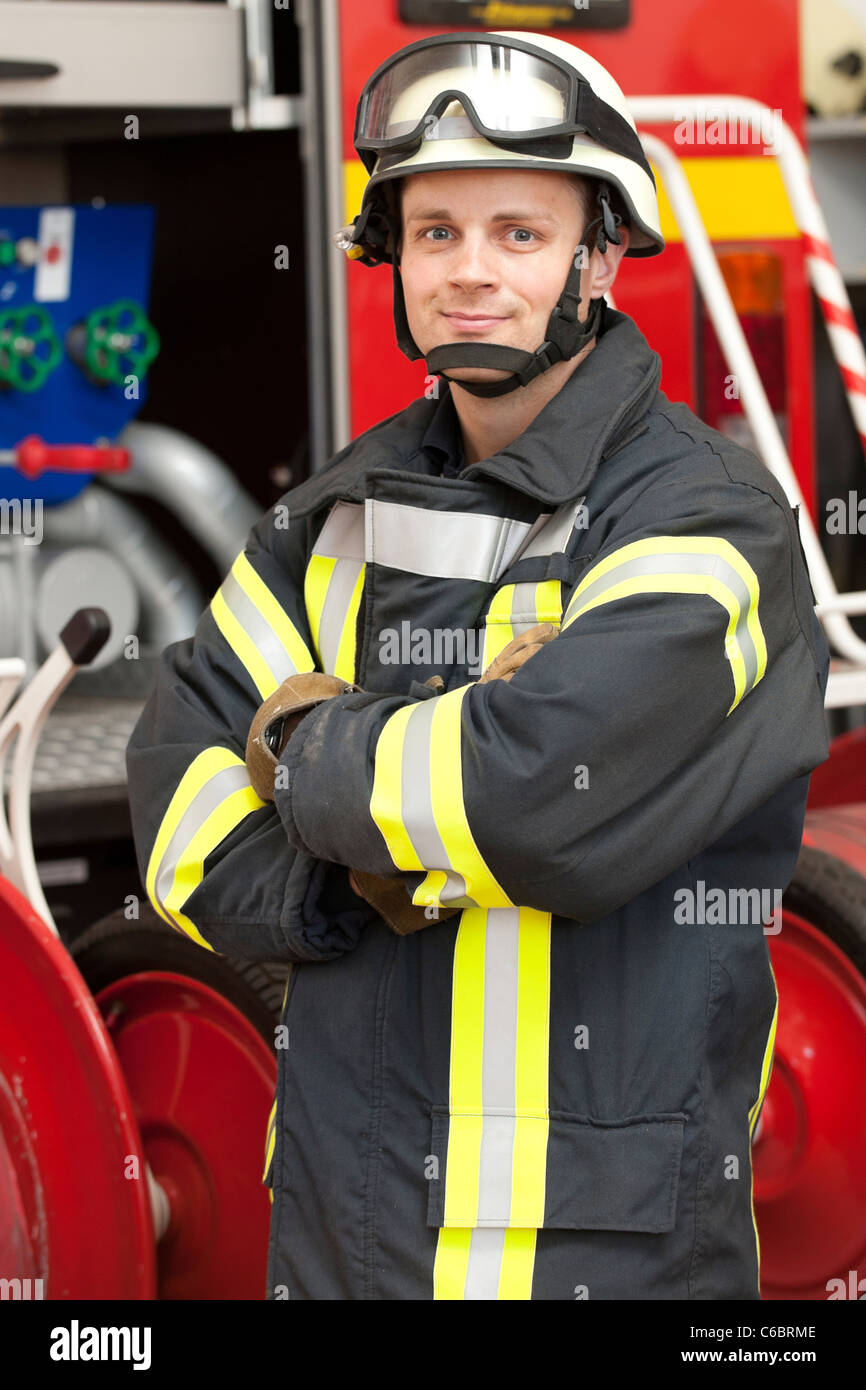 Picture from a young and successful firefighter at work Stock Photo - Alamy
