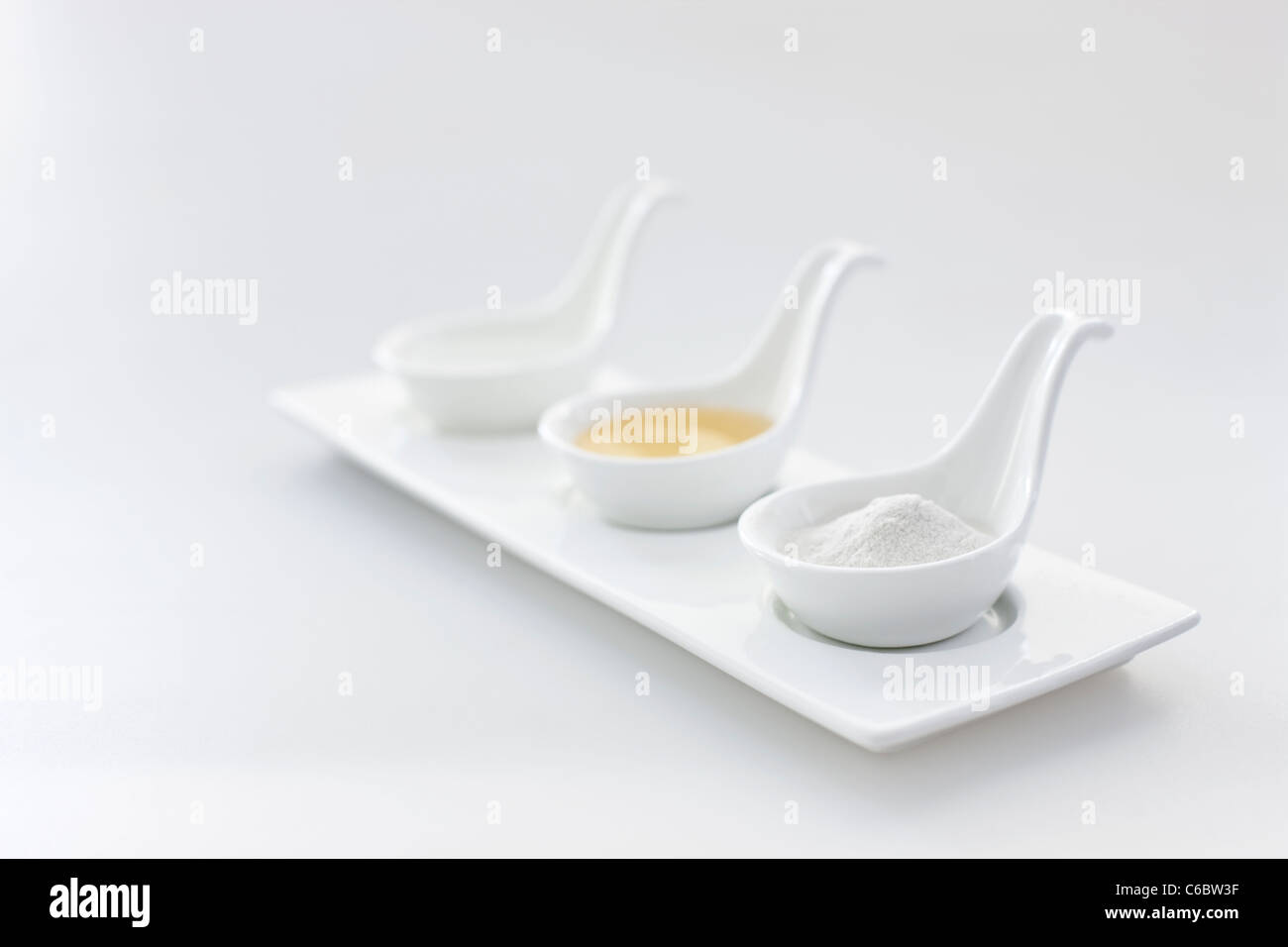 Spoons with food Stock Photo - Alamy