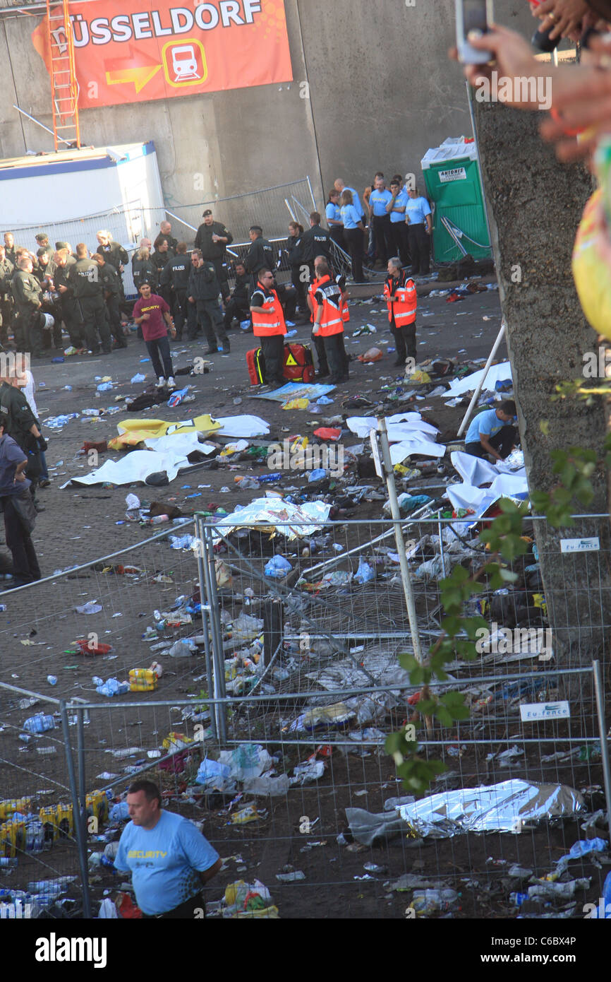 Victims are covered at the Love Parade 2010 after 19 people died and ...