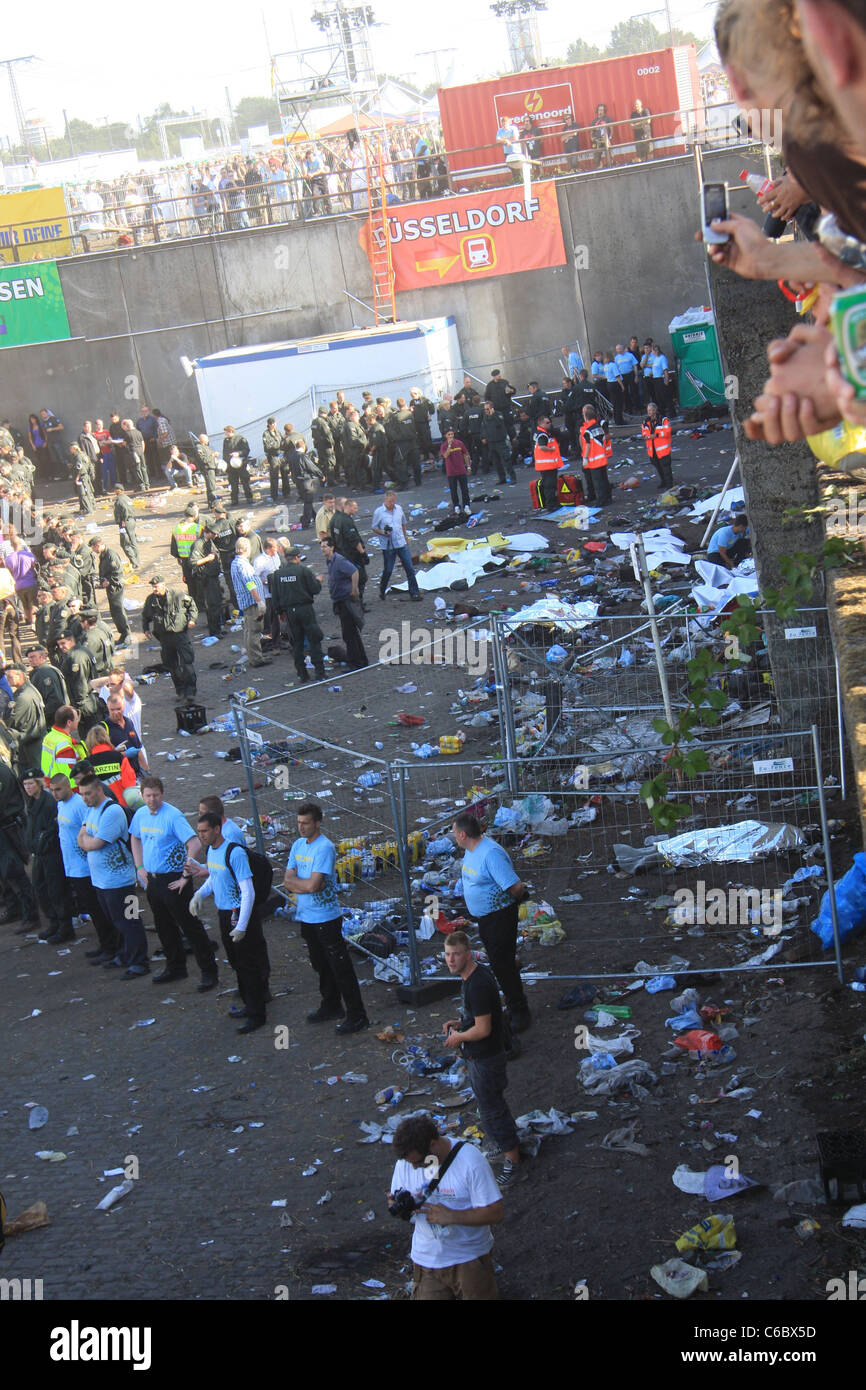 Victims are covered at the Love Parade 2010 after 19 people died and ...