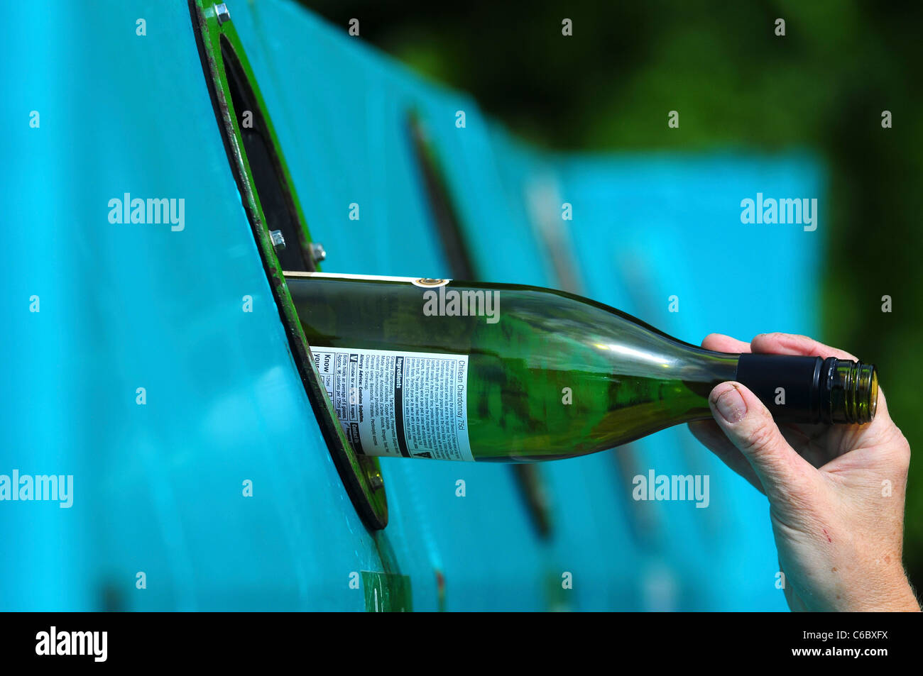 A green glass bottle being recycled UK Stock Photo - Alamy