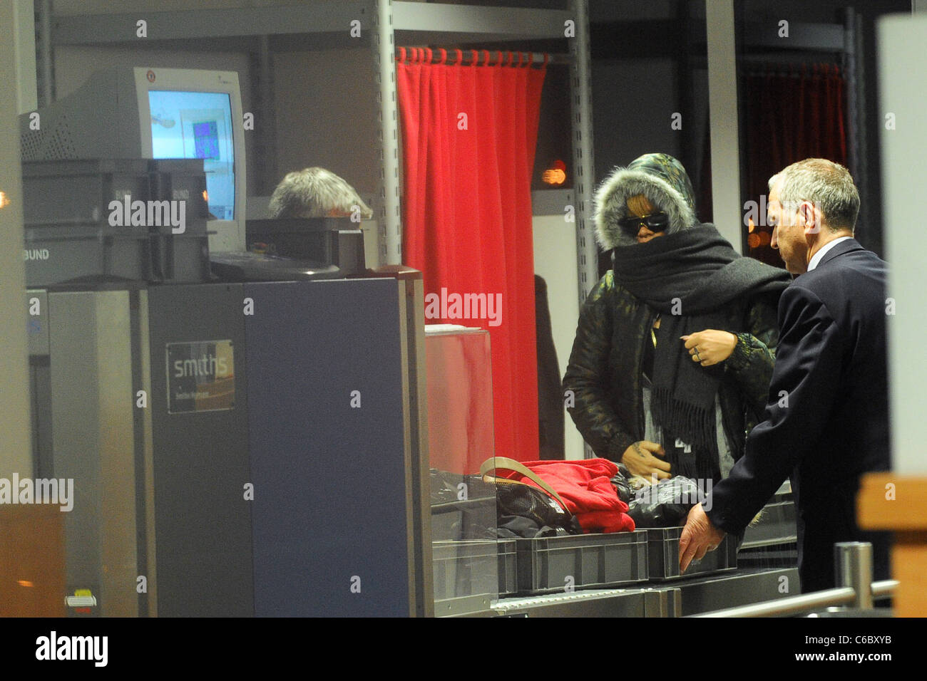 Rihanna at the security check on her way to board a private jet at ...