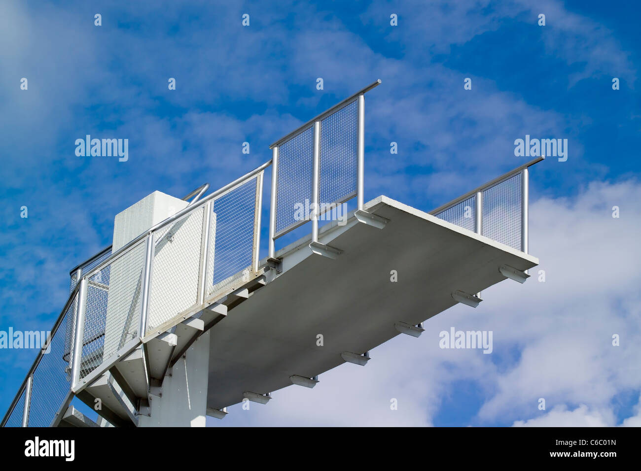 Outdoor swimming pool diving board Stock Photo - Alamy