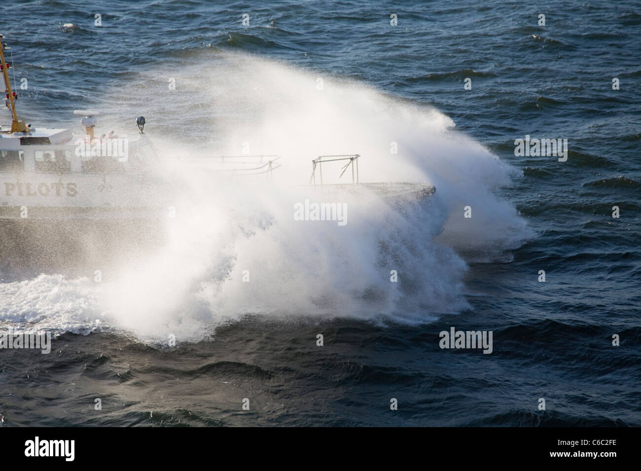 Pilot boat fighting the wawes Stock Photo - Alamy