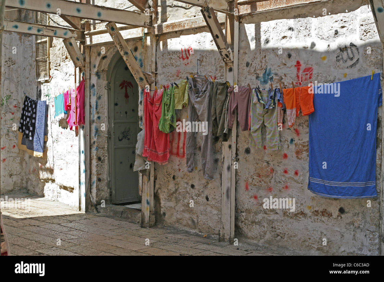 Washing drying in the streets in the old city of Jerusalem Stock Photo ...