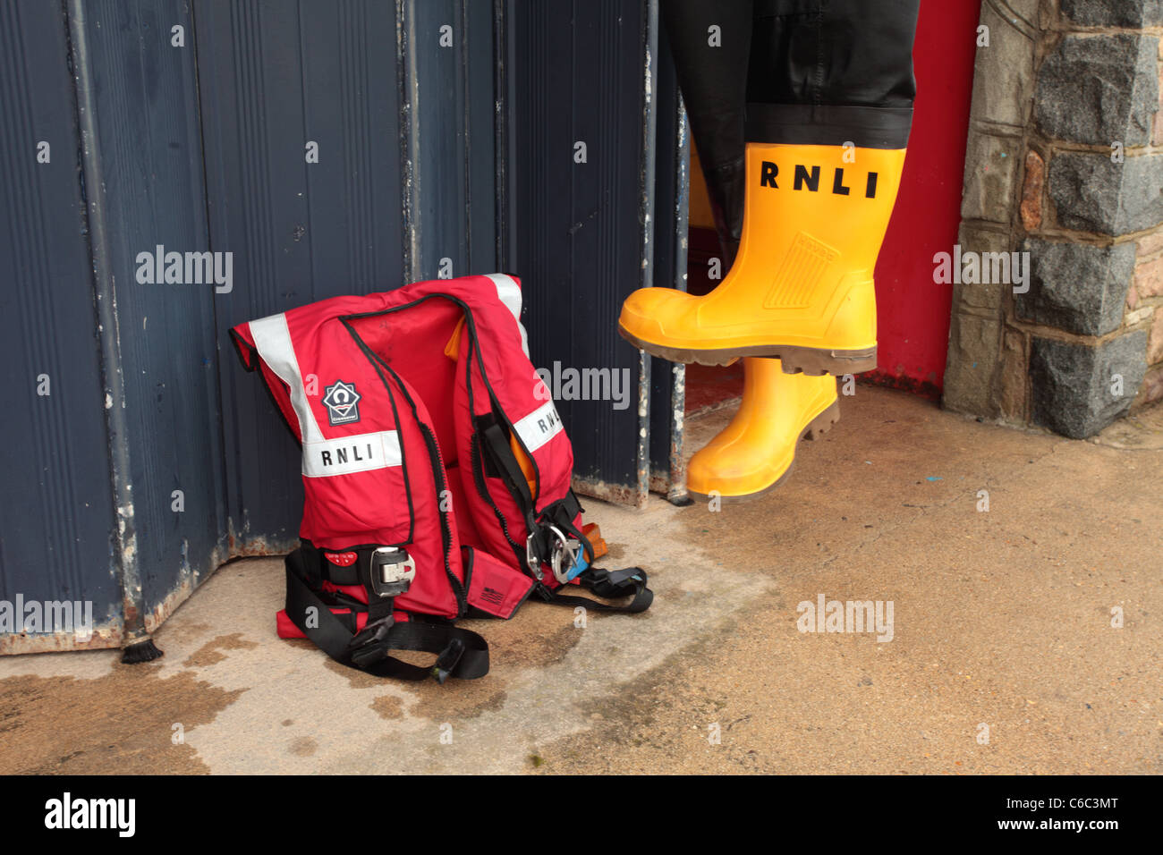 RNLI protective wear by the door of the alderney lifeboat station Stock ...