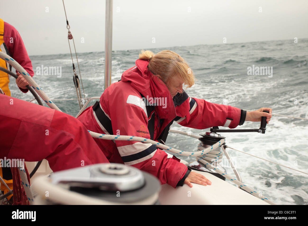 sailing yacht with single crew Stock Photo - Alamy