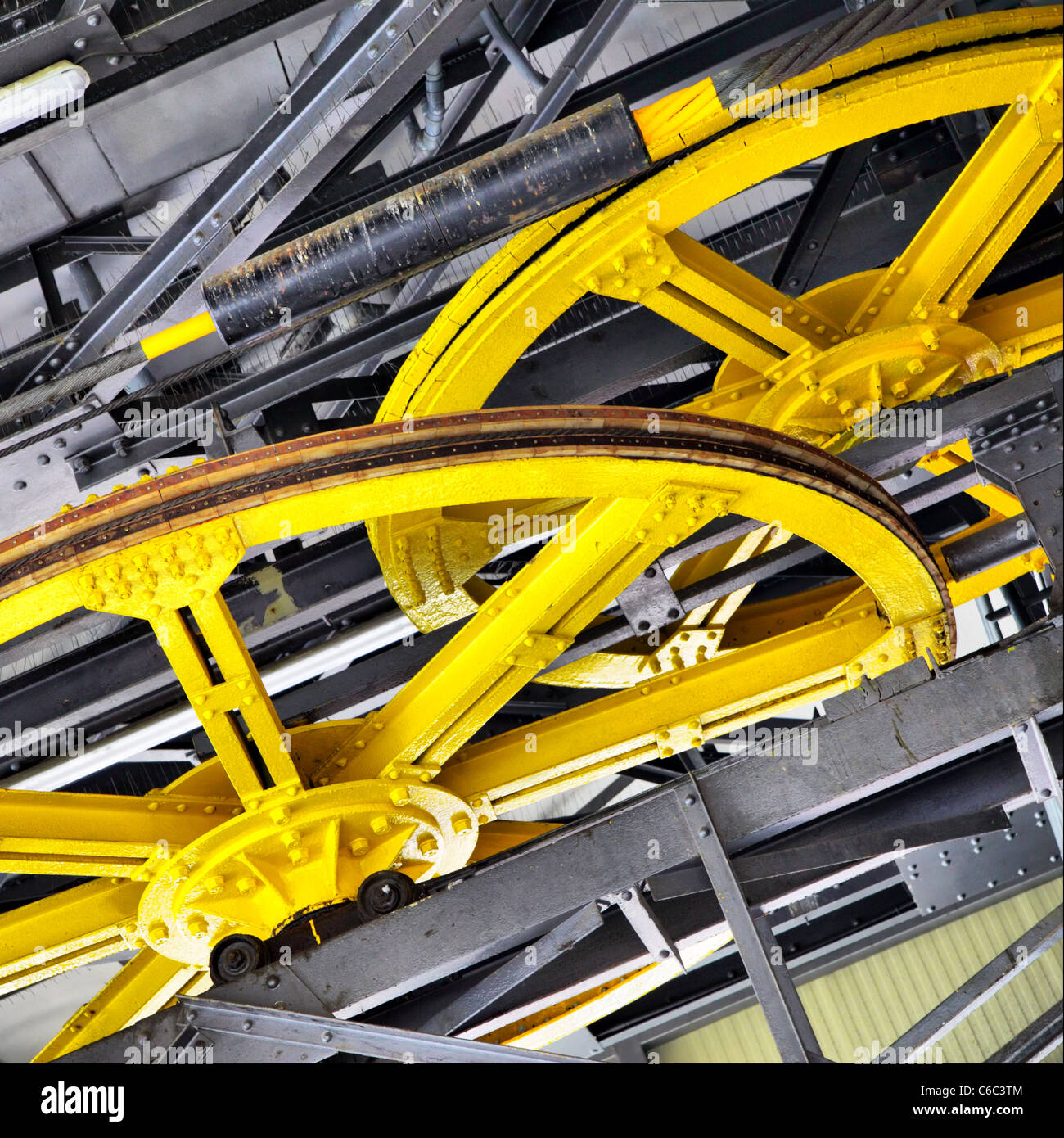 Part of mechanism with large yellow wheels Stock Photo - Alamy