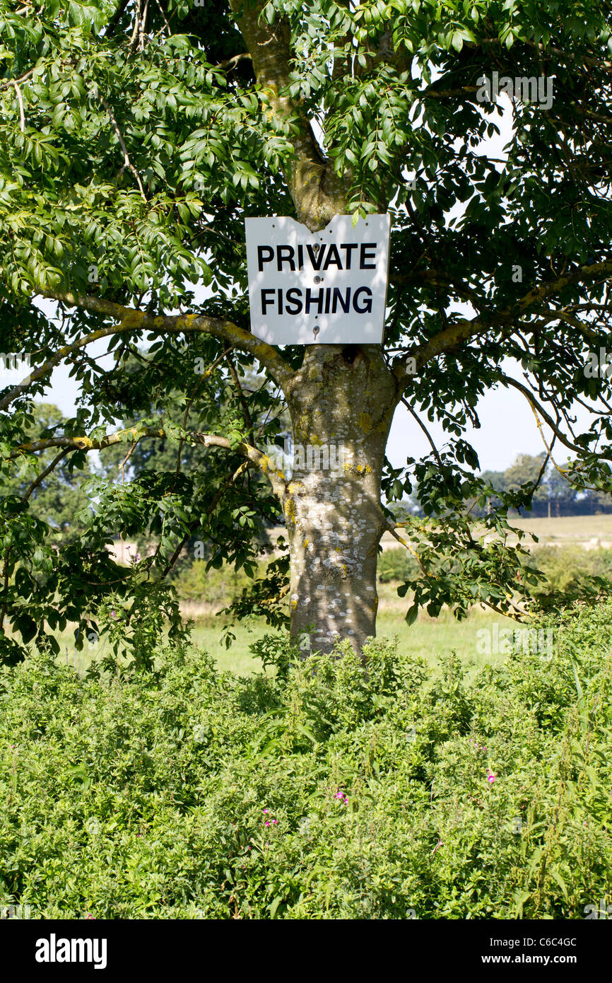Private Fishing sign attached to a tree beside the River Bure in ...