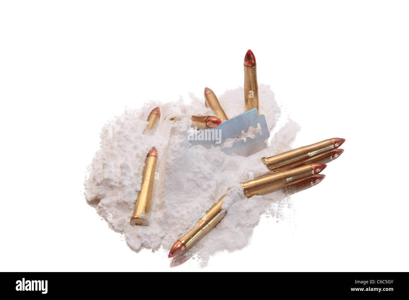 bullets and drugs showing a dangerous side to life against a white ...