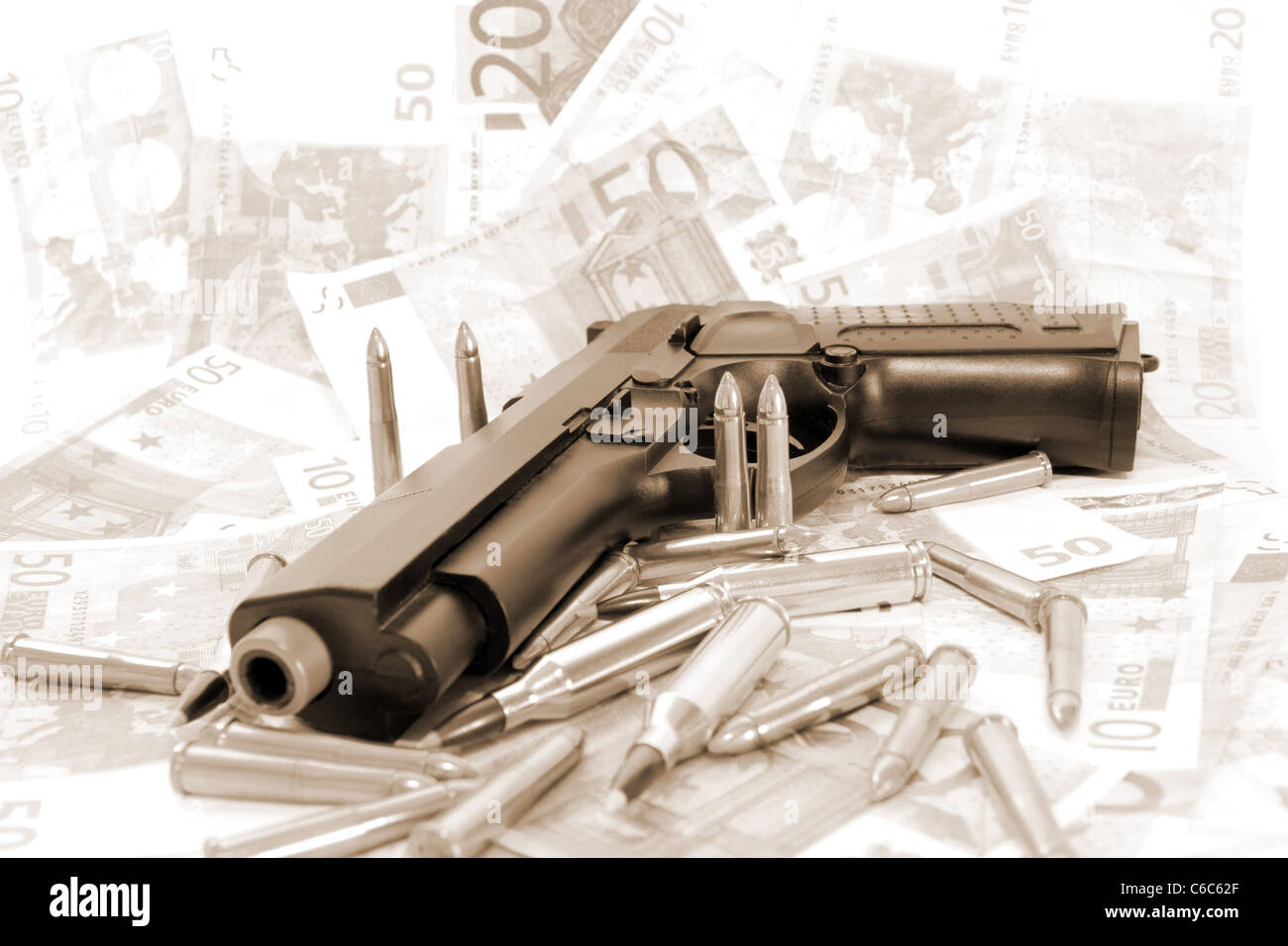 gun bullets and money showing a dangerous side to life Stock Photo - Alamy