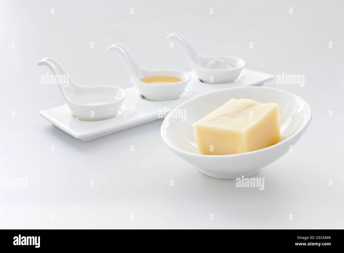 Spoons and cheese Stock Photo - Alamy