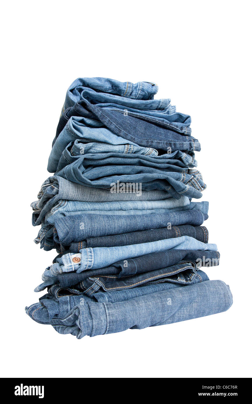 Pile of denim jeans isolated on a white background Stock Photo - Alamy