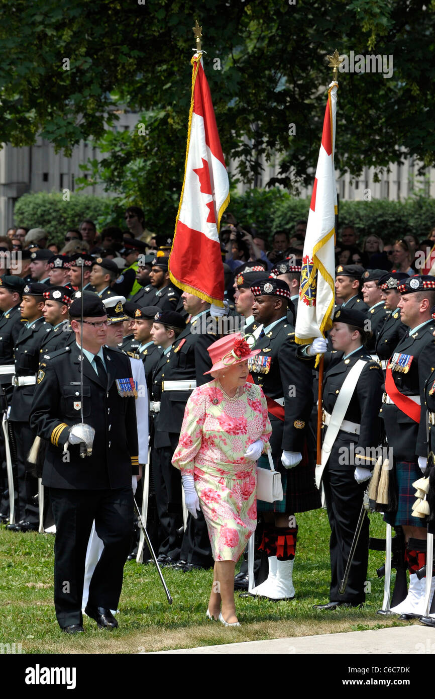 Queen Elizabeth II unveiling a commemorative plaque marking 150 years ...