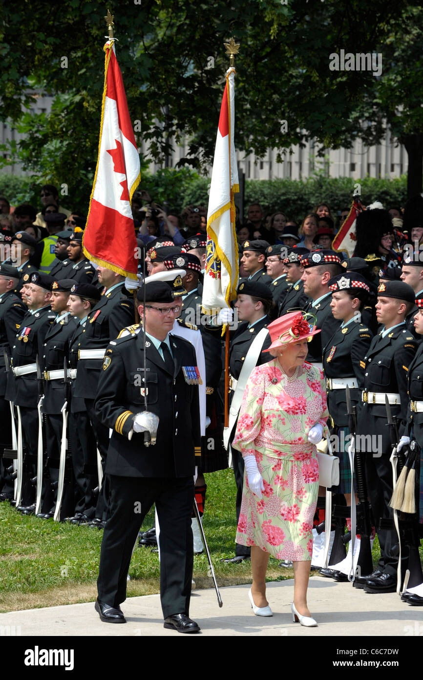 Queen Elizabeth II unveiling a commemorative plaque marking 150 years ...