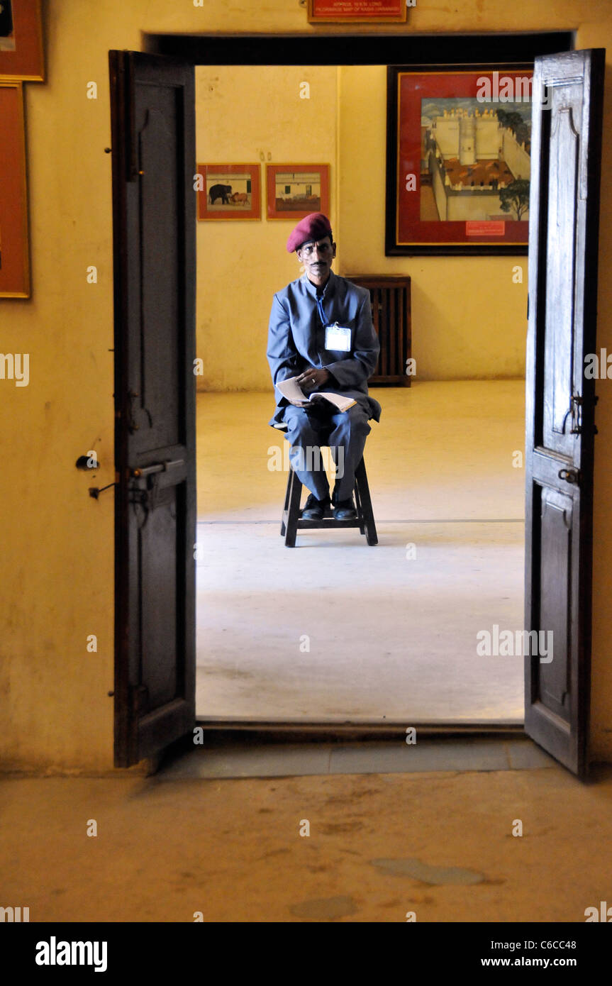 Seated guard inside City Palace Udaipur Rajasthan India Stock Photo - Alamy
