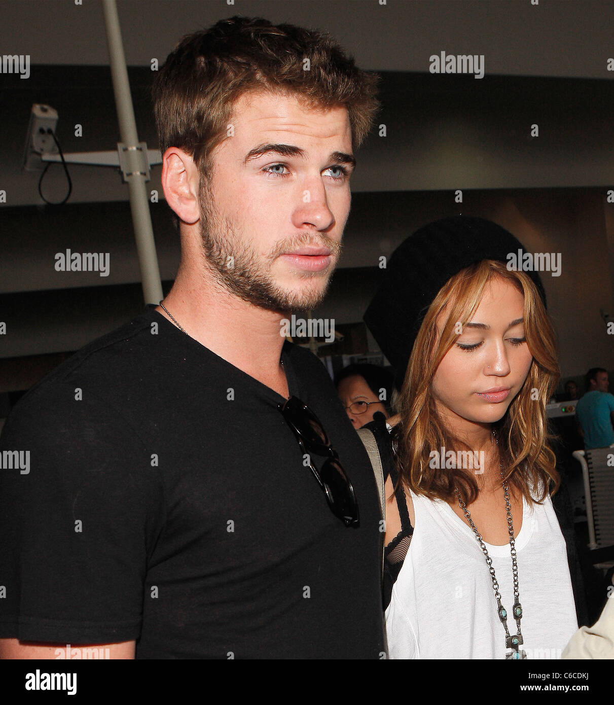 Miley Cyrus and Liam Hemsworth Miley Cyrus arrives at LAX airport on a ...