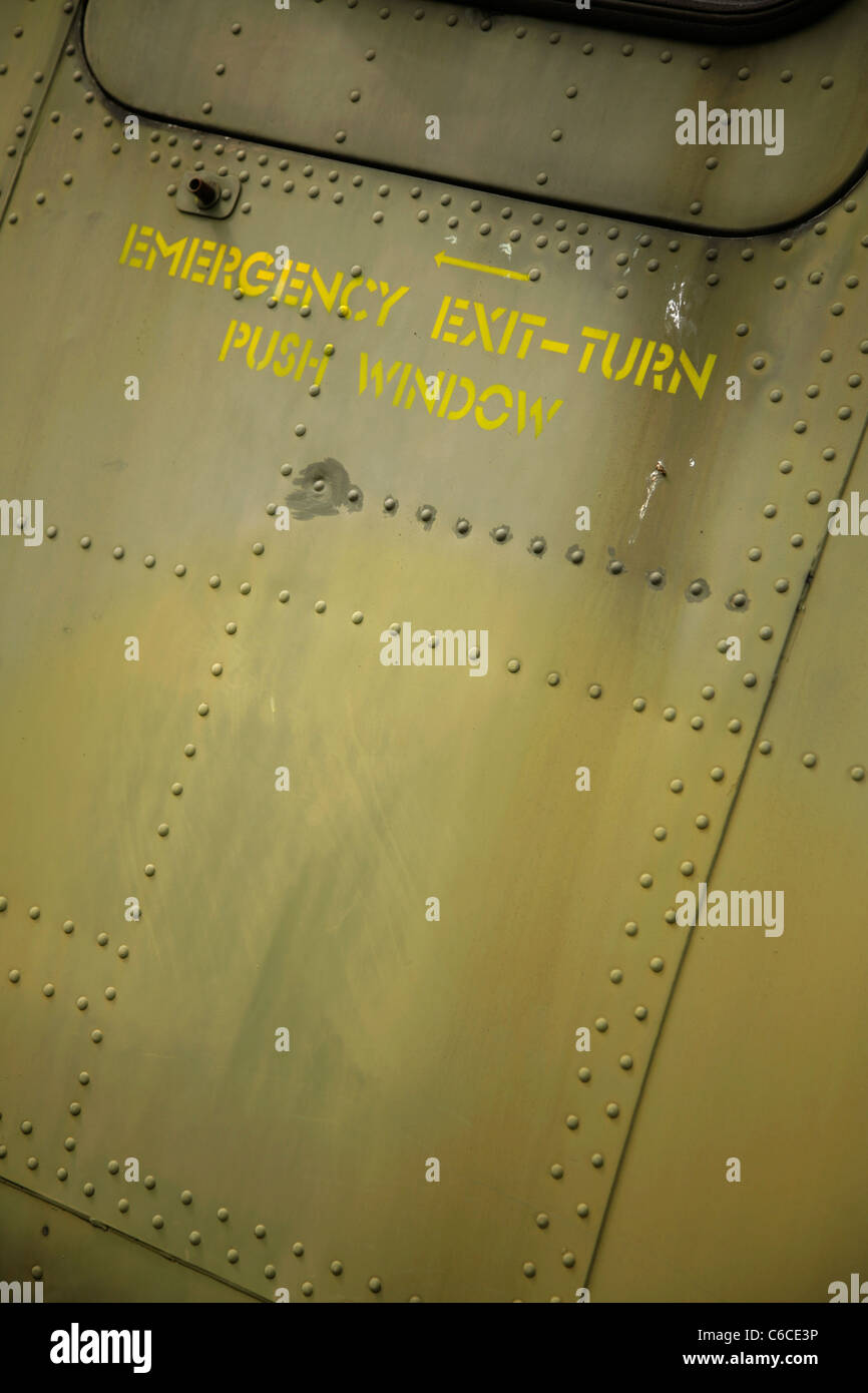 Emergency exit panel on side of military helicopter Stock Photo - Alamy