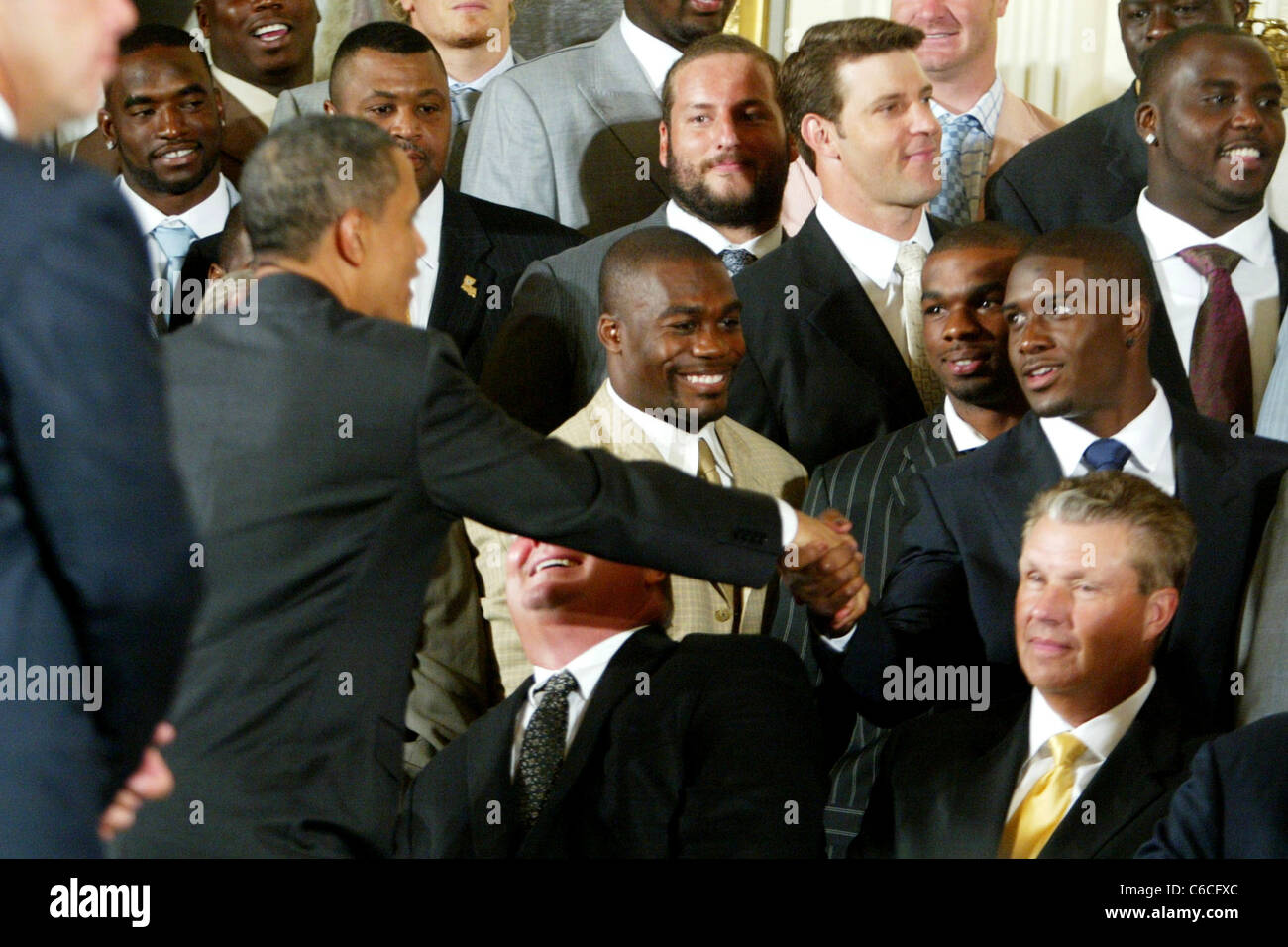 Reggie Bush shakes hands with Reggie Bush U.S. President Barack Obama ...