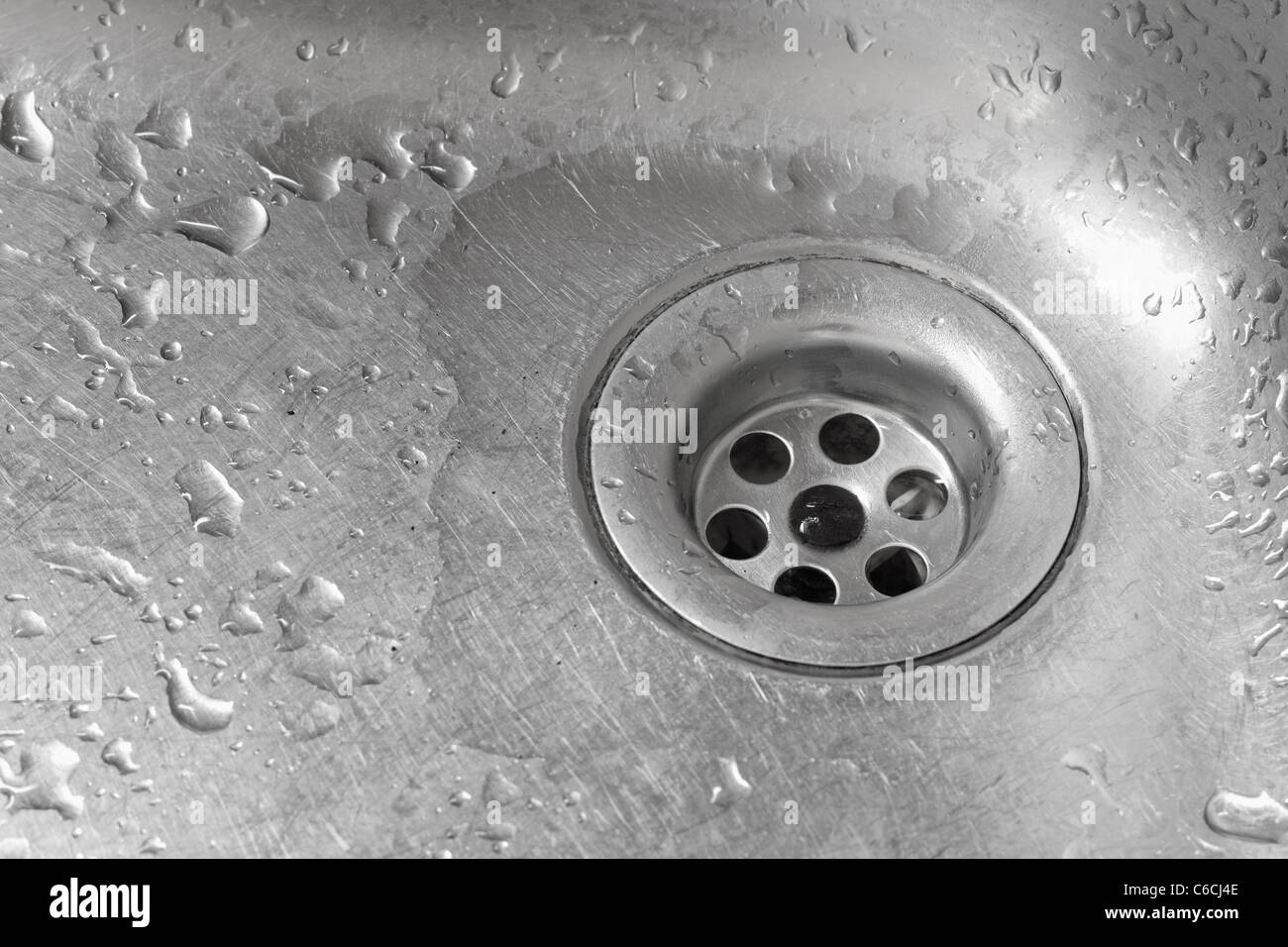 Metallic Kitchen sink with water drops shot from from above Stock Photo ...