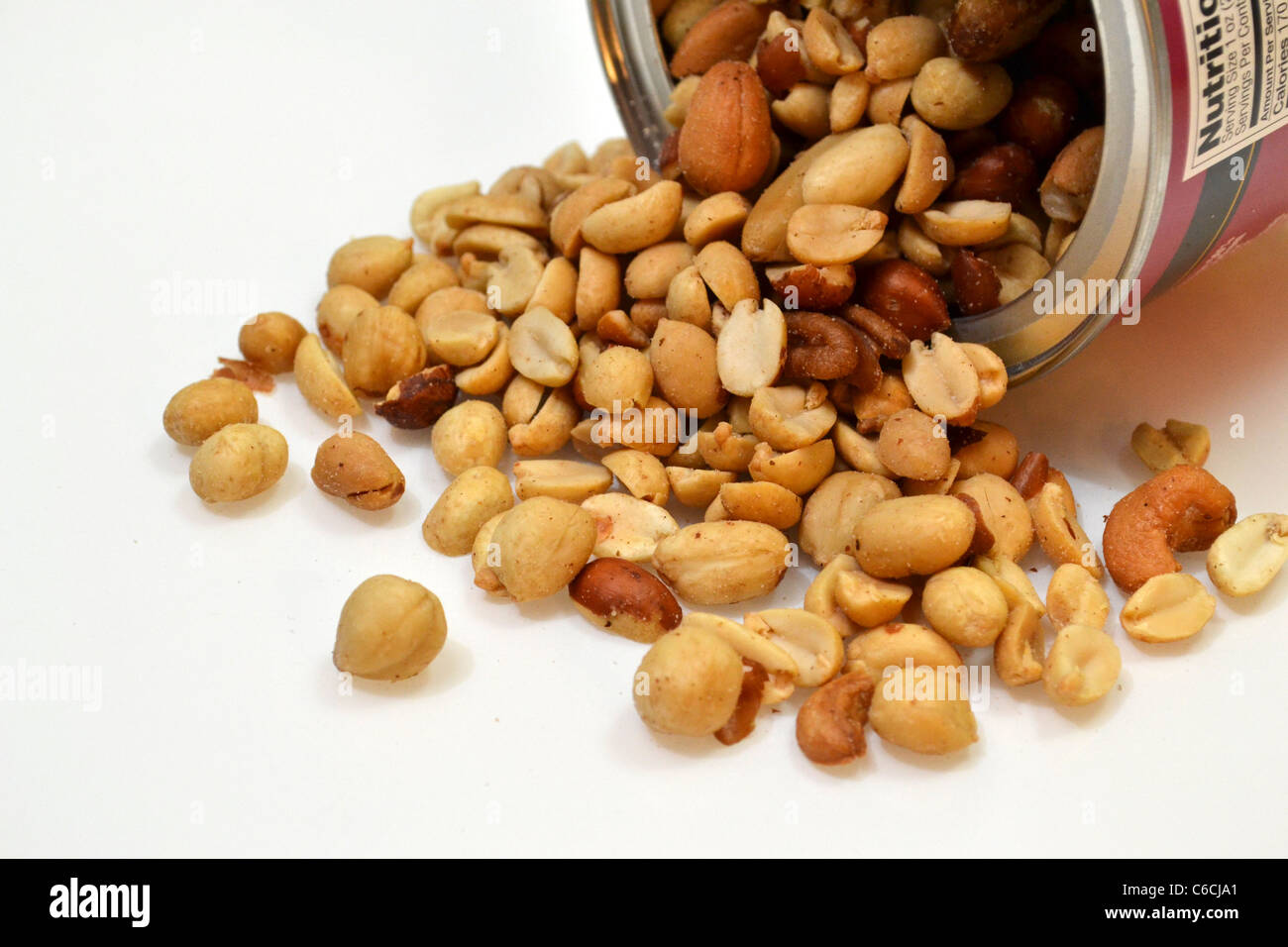 A open can of mixed nuts lays on it's side Stock Photo - Alamy