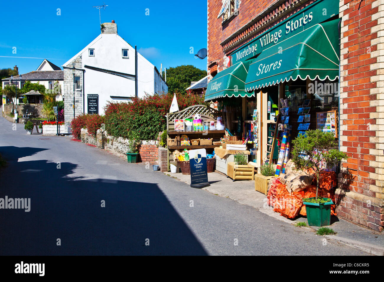 The main street through the pretty village of Morthoe near Woolacombe ...