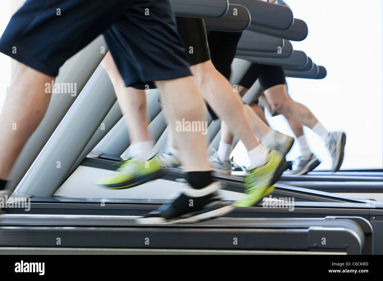 People running on treadmills in health club Stock Photo - Alamy