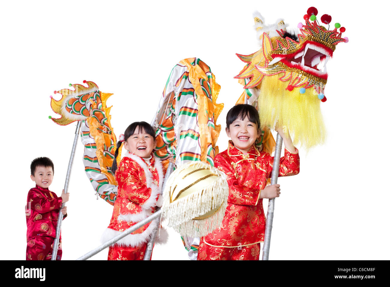 Three Chinese children holding Chinese dragon Stock Photo - Alamy