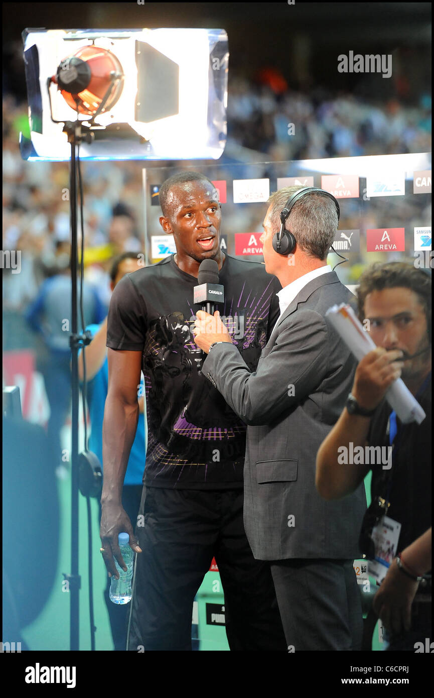 Jamaican Usain Bolt gets interviewed after he winning the men's 100m ...