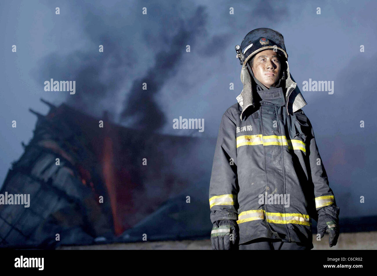 Firefighters try to put out the remaining fire after blasts hit two oil ...