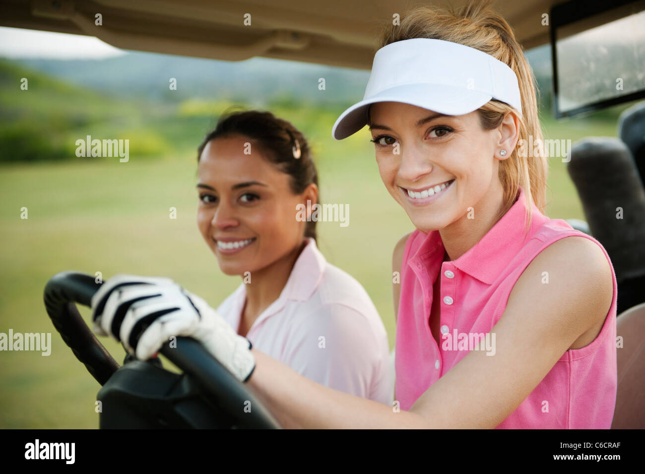 Women driving golf cart on hi-res stock photography and images - Alamy