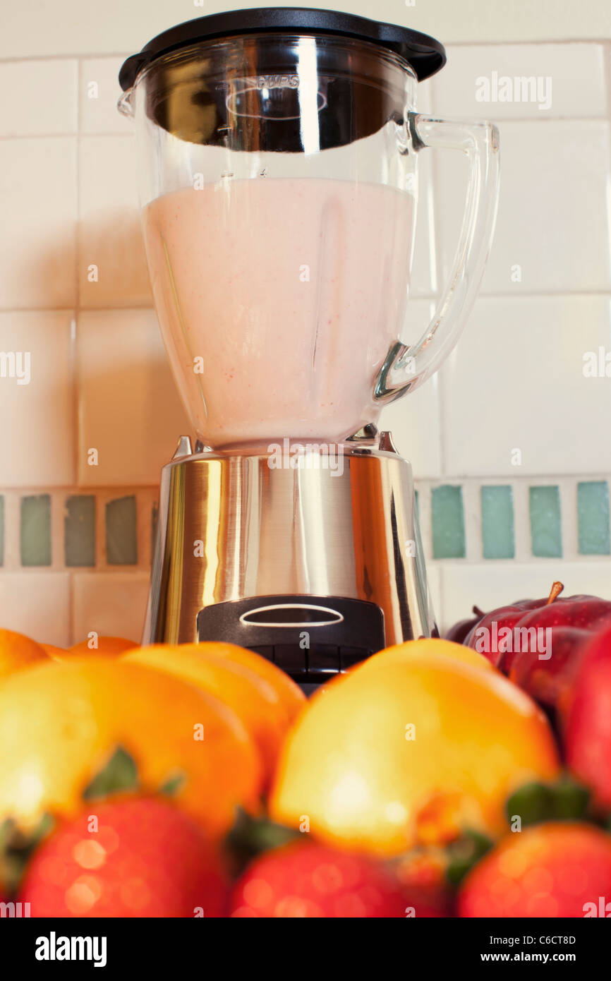 Fruits and blender in kitchen counter Stock Photo - Alamy