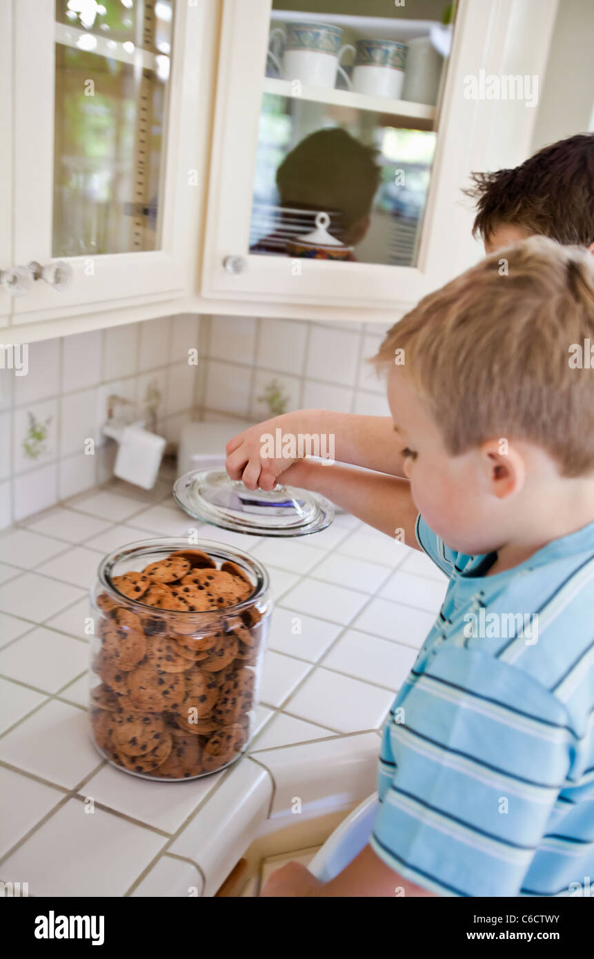 Two boys brothers sharing drink hi-res stock photography and images - Alamy